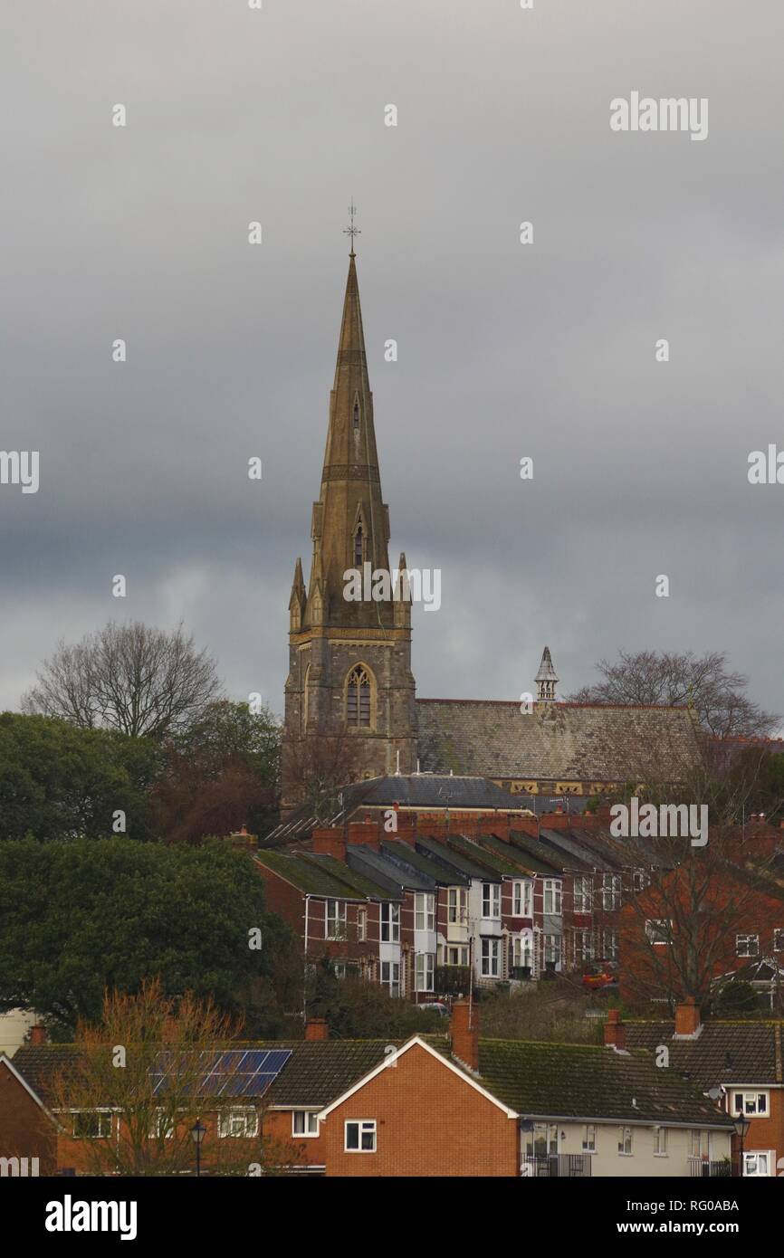 St Leonards Church beyond Trews Weir on the River Exe. on a Gloomy ...
