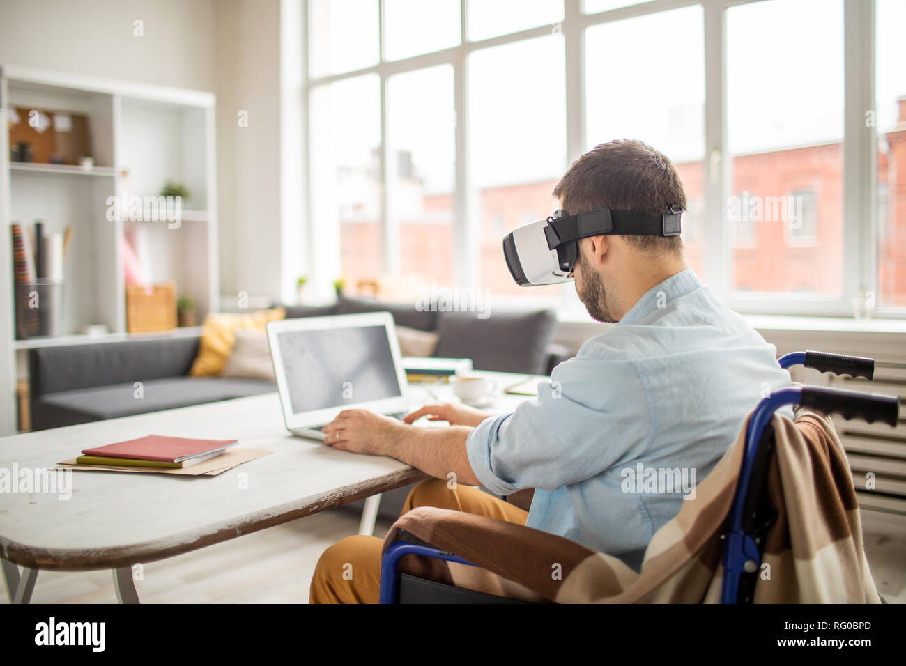 Disable man in virtual reality Stock Photo - Alamy