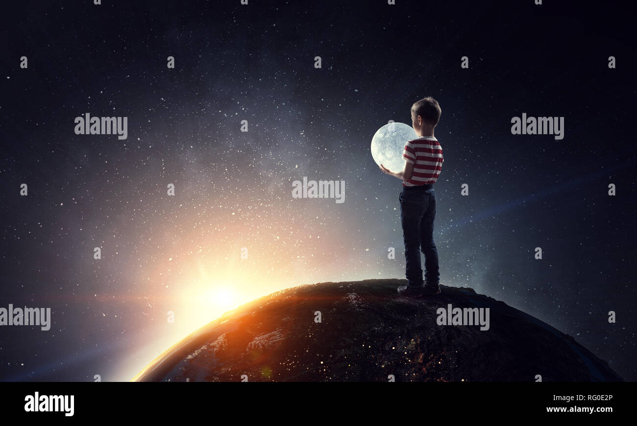 Kid boy holding glowing moon planet in hands . Mixed media. Elements of ...