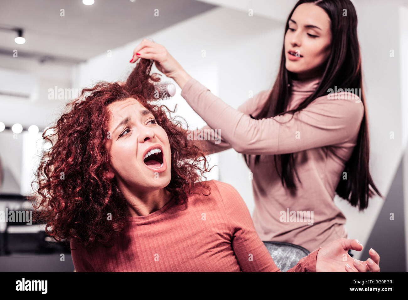 Depressed angry woman feeling pain in her head Stock Photo - Alamy