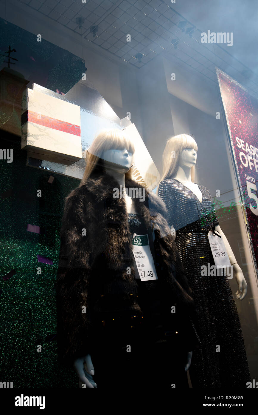 Female manikins window display in retail clothing store Stock Photo - Alamy