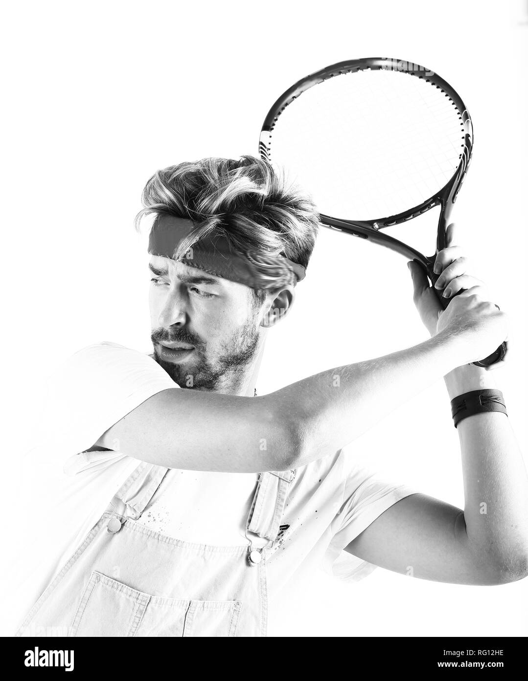 Male tennis player with racket in action Stock Photo - Alamy