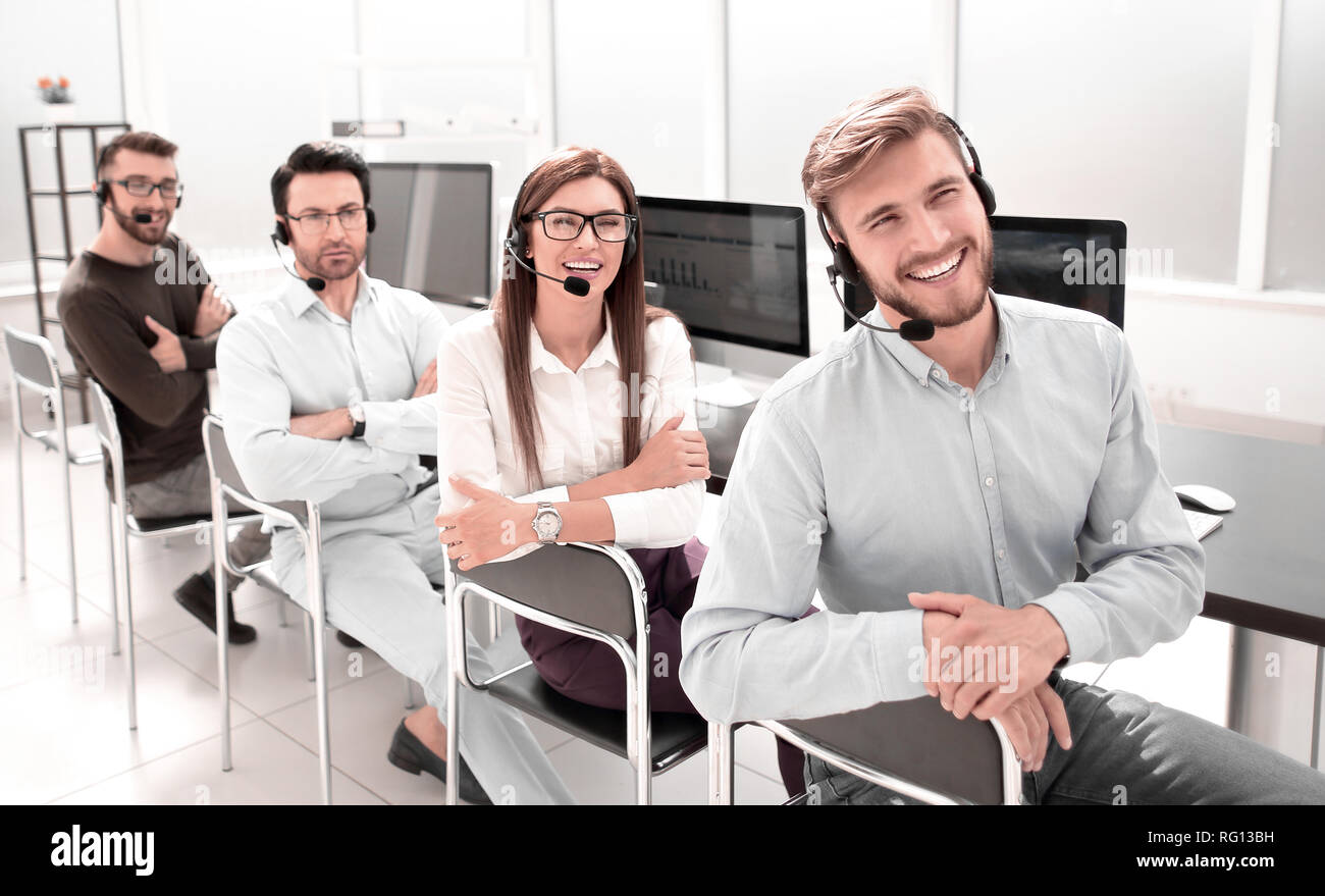 smiling operators support in the workplace Stock Photo - Alamy