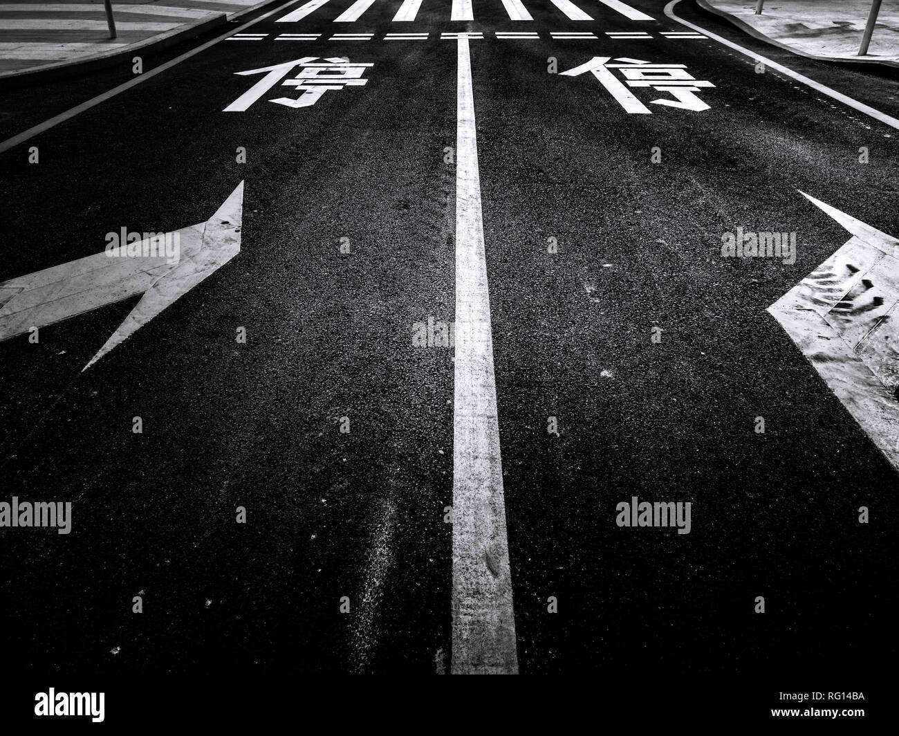 Stop sign painted on the road asphalt, sign means "Stop". Urban road ...