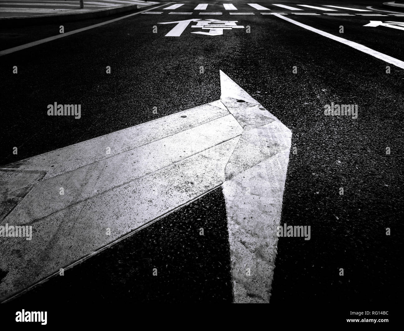 Stop sign painted on the road asphalt, sign means "Stop". Urban road ...