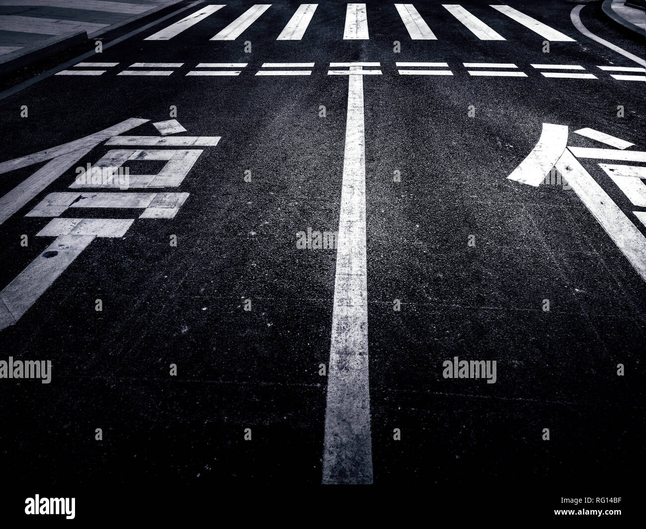 Stop sign painted on the road asphalt, sign means "Stop". Urban road ...