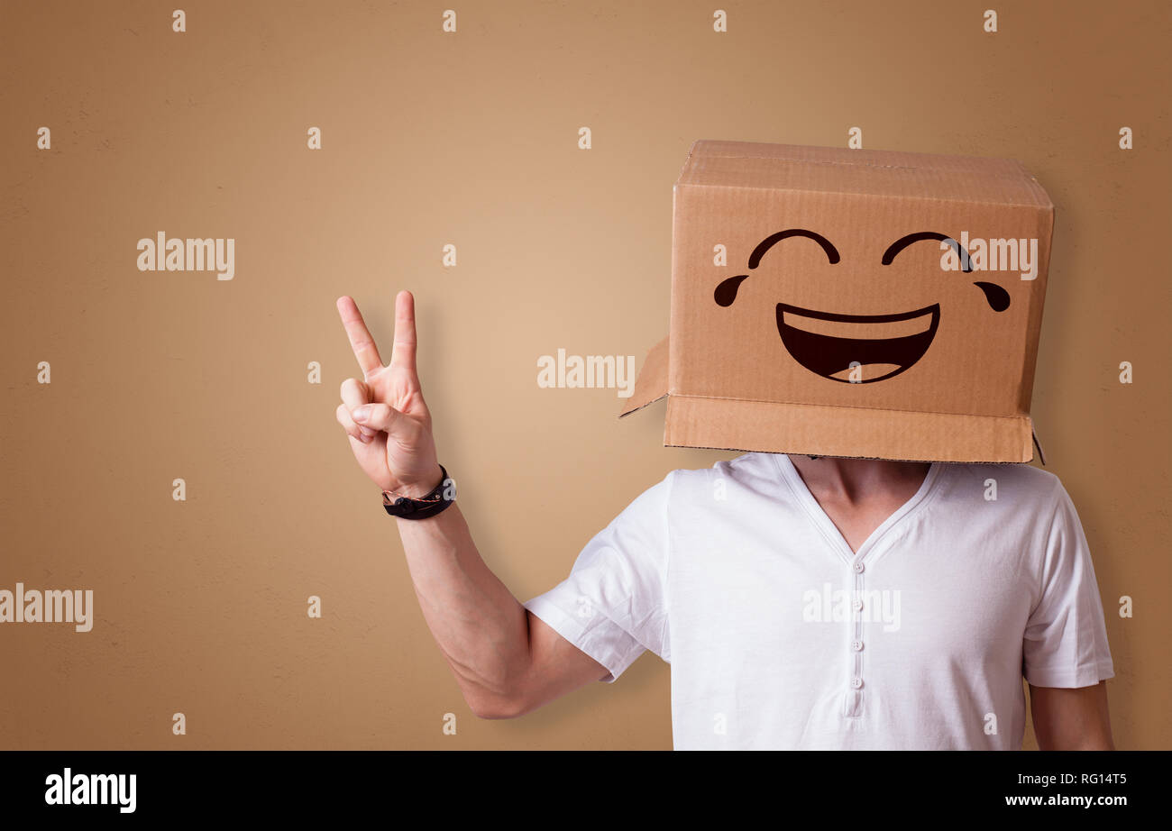 Funny man wearing cardboard box on his head with smiley face Stock ...