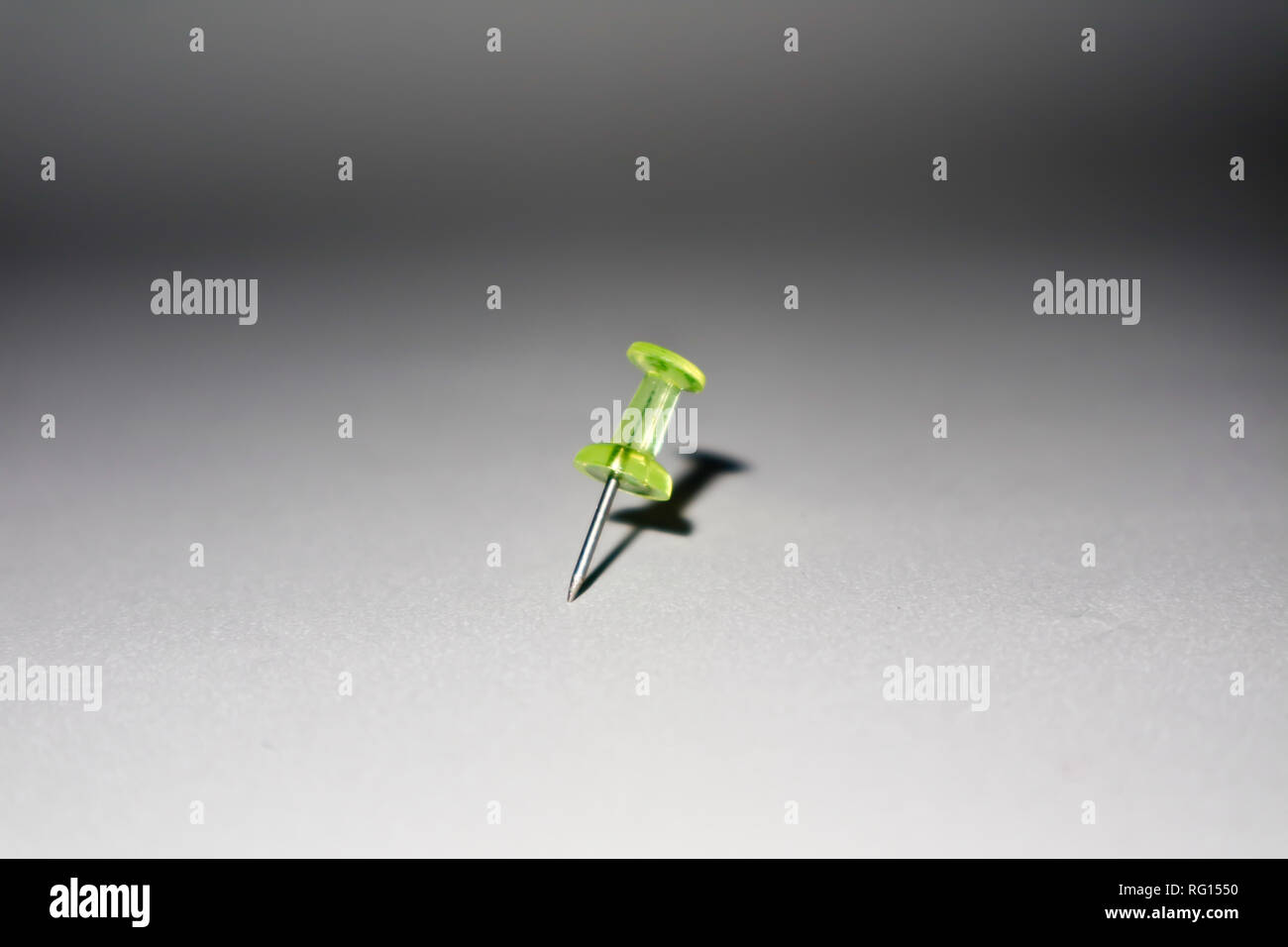 pin sticked in white background Stock Photo - Alamy