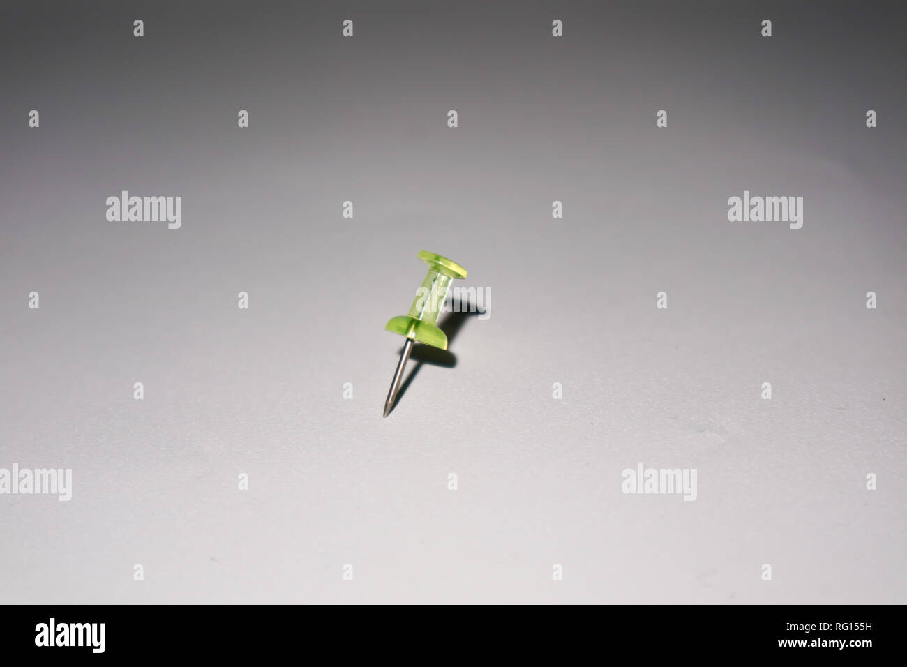 pin sticked in white background Stock Photo - Alamy
