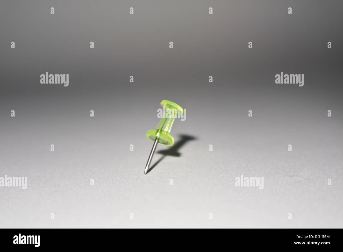 pin sticked in white background Stock Photo - Alamy