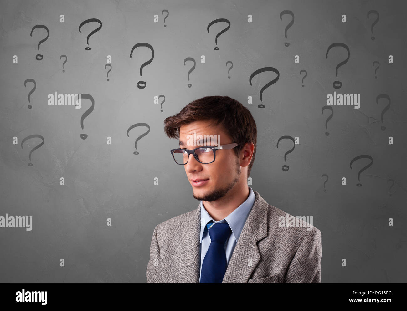 Person with question marks around face Stock Photo - Alamy