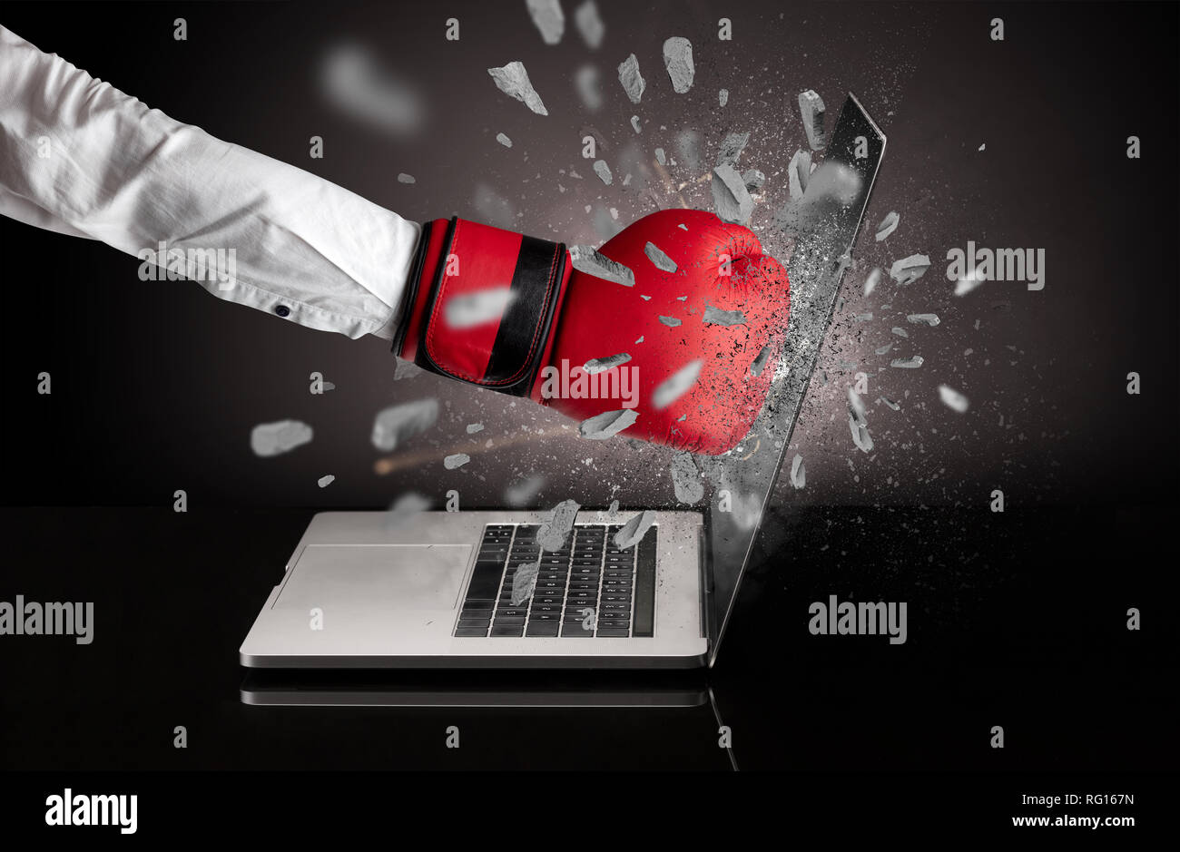 Strong male hand breaks laptop screen Stock Photo - Alamy