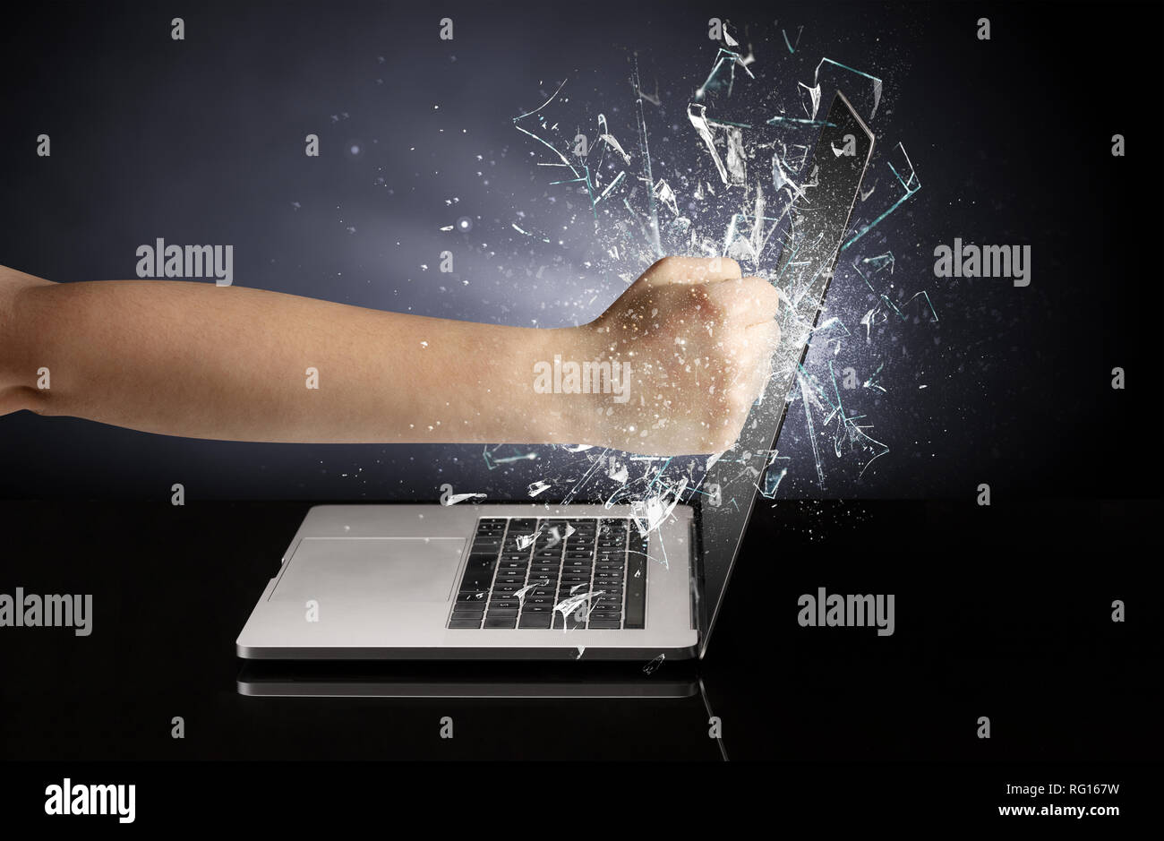 Hand hitting strongly laptop screen glass Stock Photo - Alamy