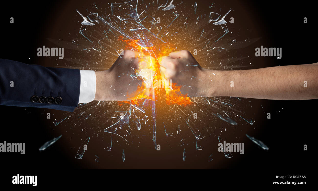 Two hands fighting and breaking a glass into small pieces Stock Photo ...