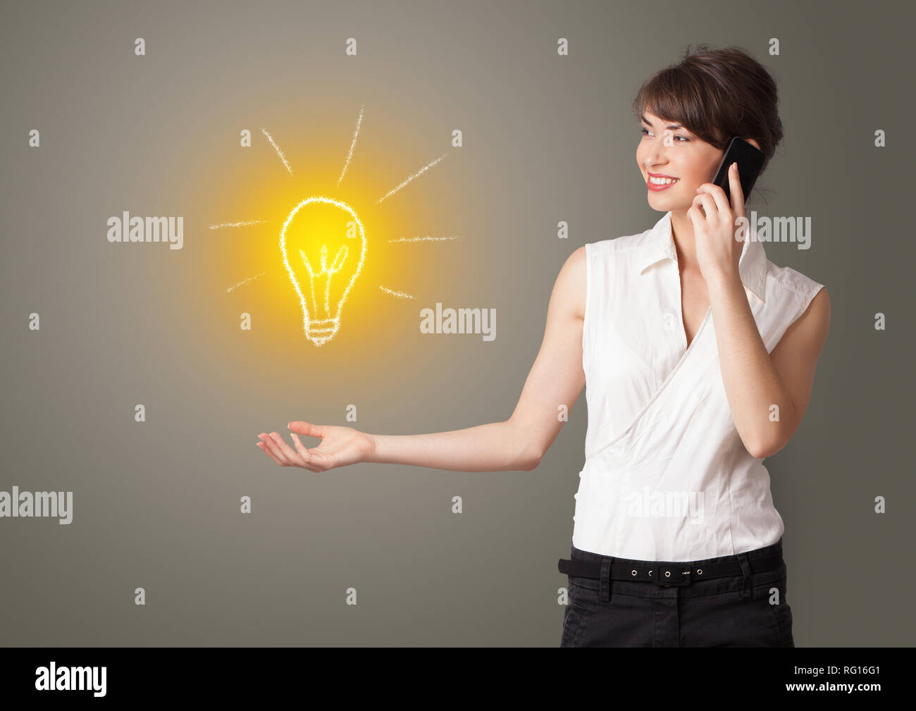 Young smiling person presenting new idea concept Stock Photo - Alamy