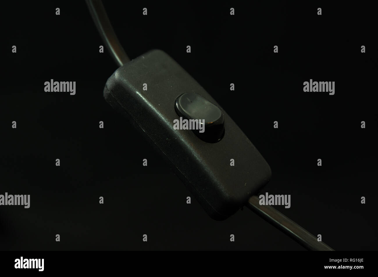 black table lamp switch on black background isolated Stock Photo - Alamy
