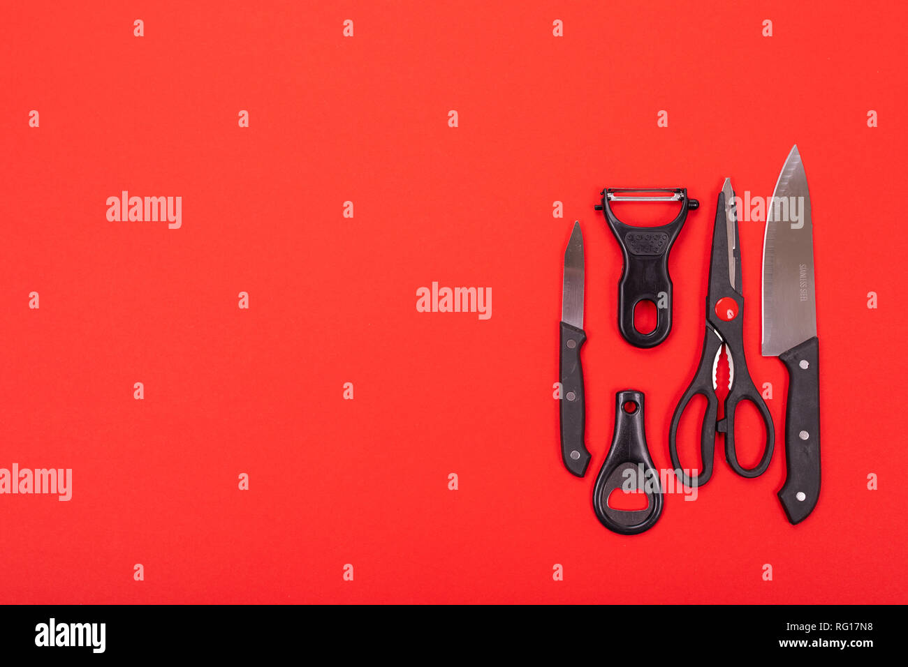 top view of the cutting with kitchen utensils isolated on a red ...