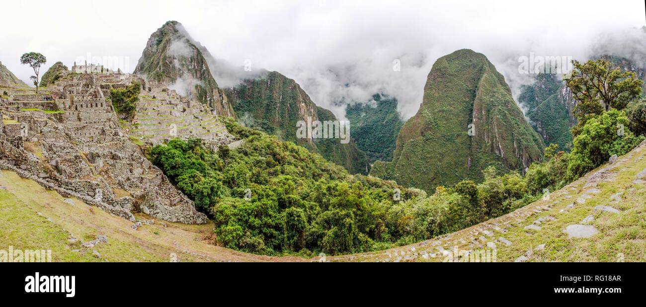 Panoramic view of Machu Picchu, the world famous ancient inca city, hidden in the cloud forest ...