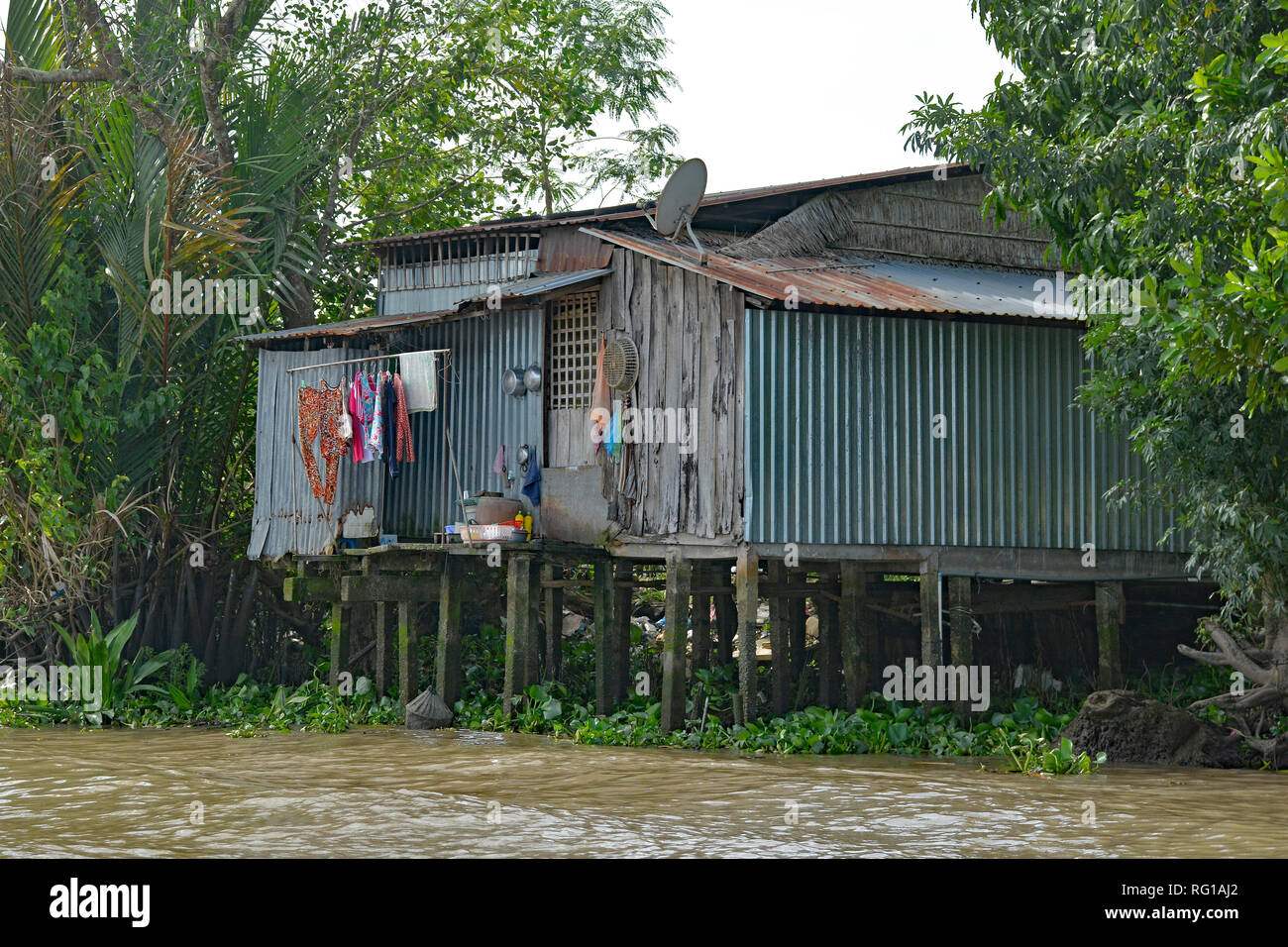 A small stilt house which look out onto a waterway near Can Tho in the ...
