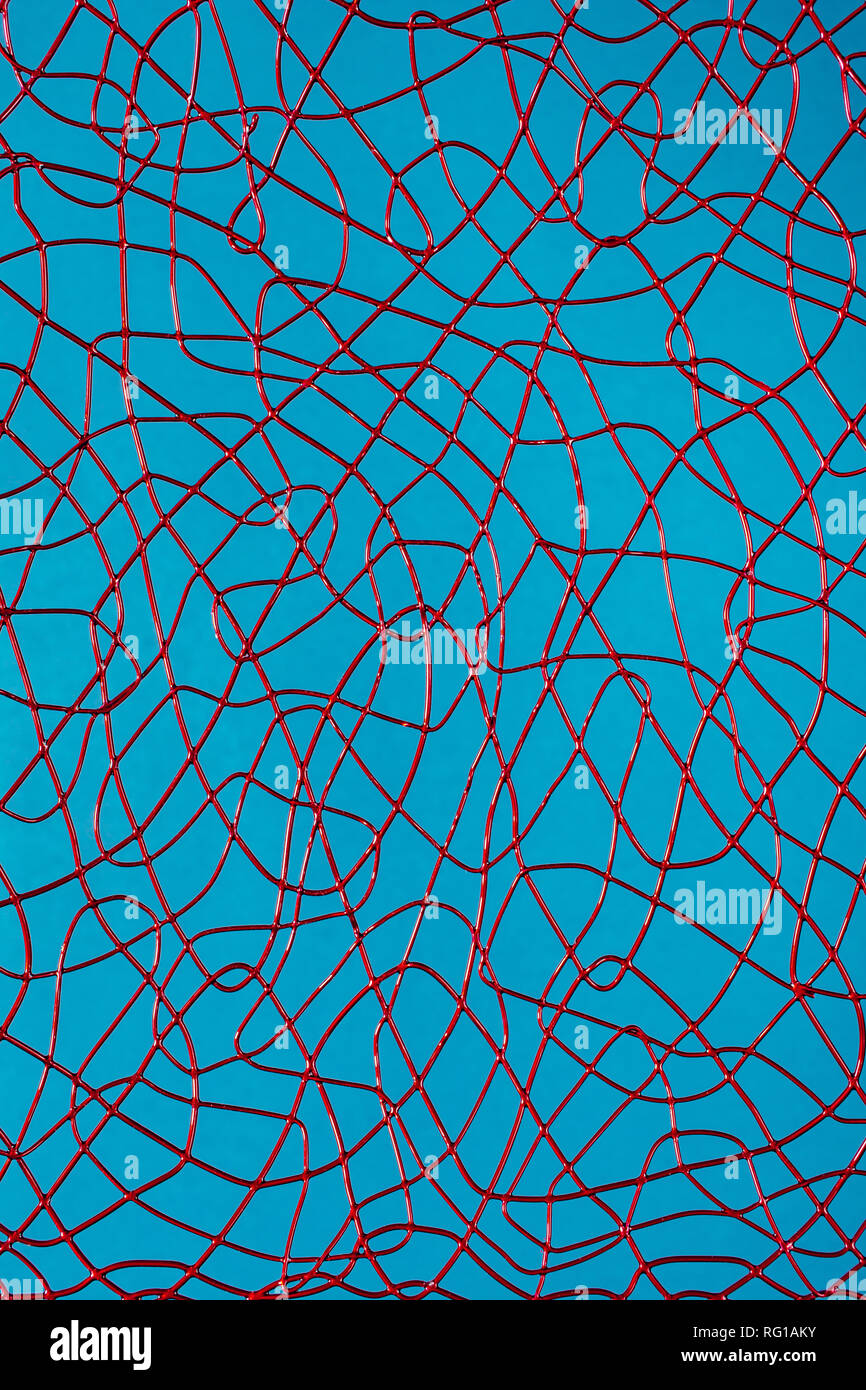 Randomly curved wire on deep blue background Stock Photo - Alamy