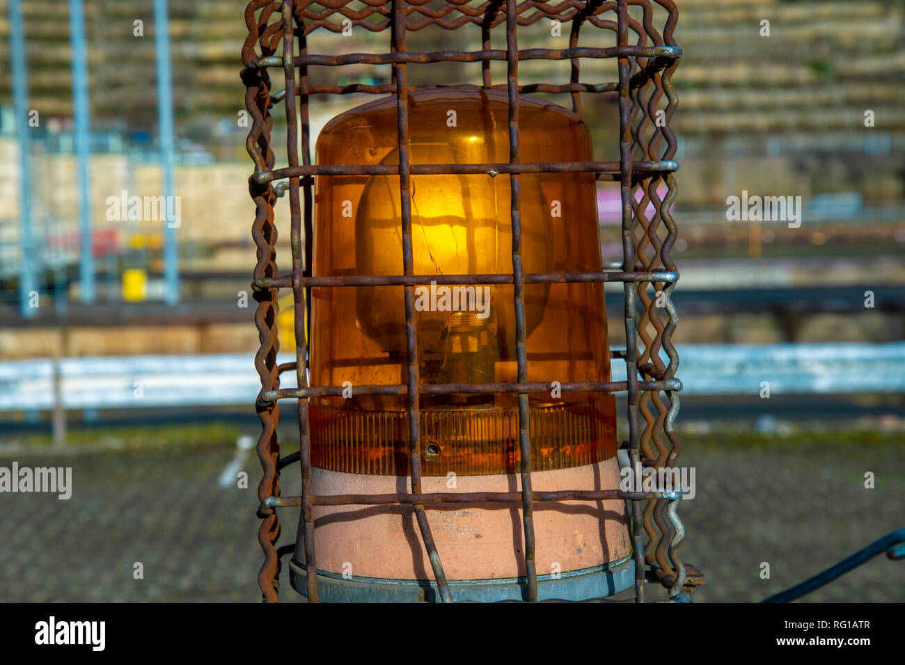 orange warning light behind a safety fence Stock Photo - Alamy