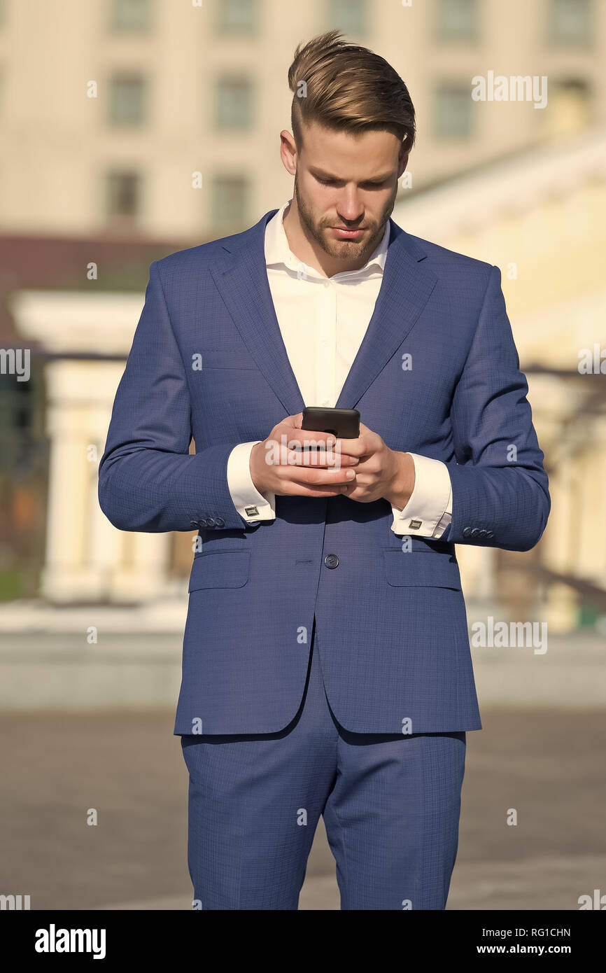 Message concept. Man in suit businessman takes advantages of modern ...