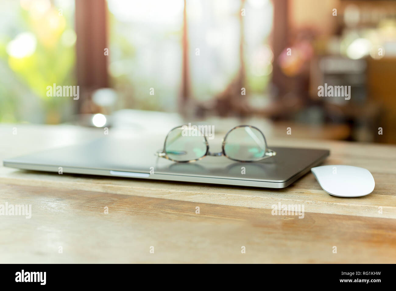 Selected focus computer mouse with eye glasses on top Stock Photo - Alamy