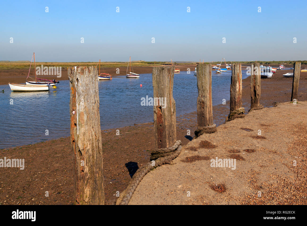 Wooden boat mooring posts on the quay at Burnham-Overy-Staithe on the ...