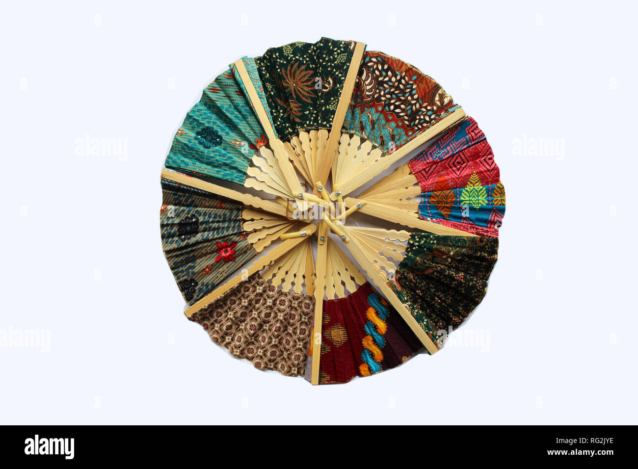A wooden hand fan in Javanese cloth called batik. Exotic Stock Photo ...