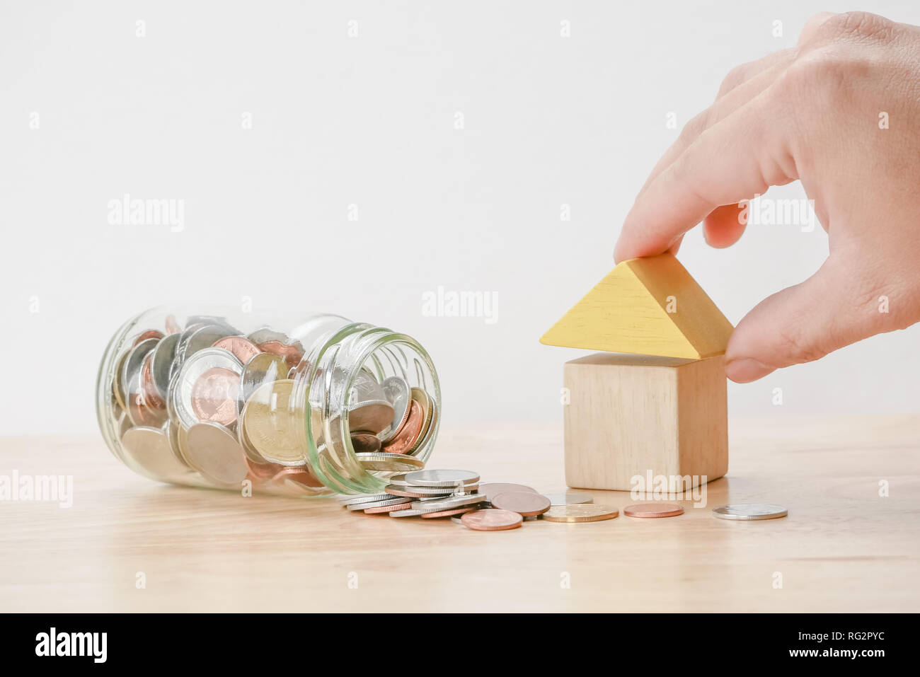 save money for investment mortgage concept by wood block house Stock ...