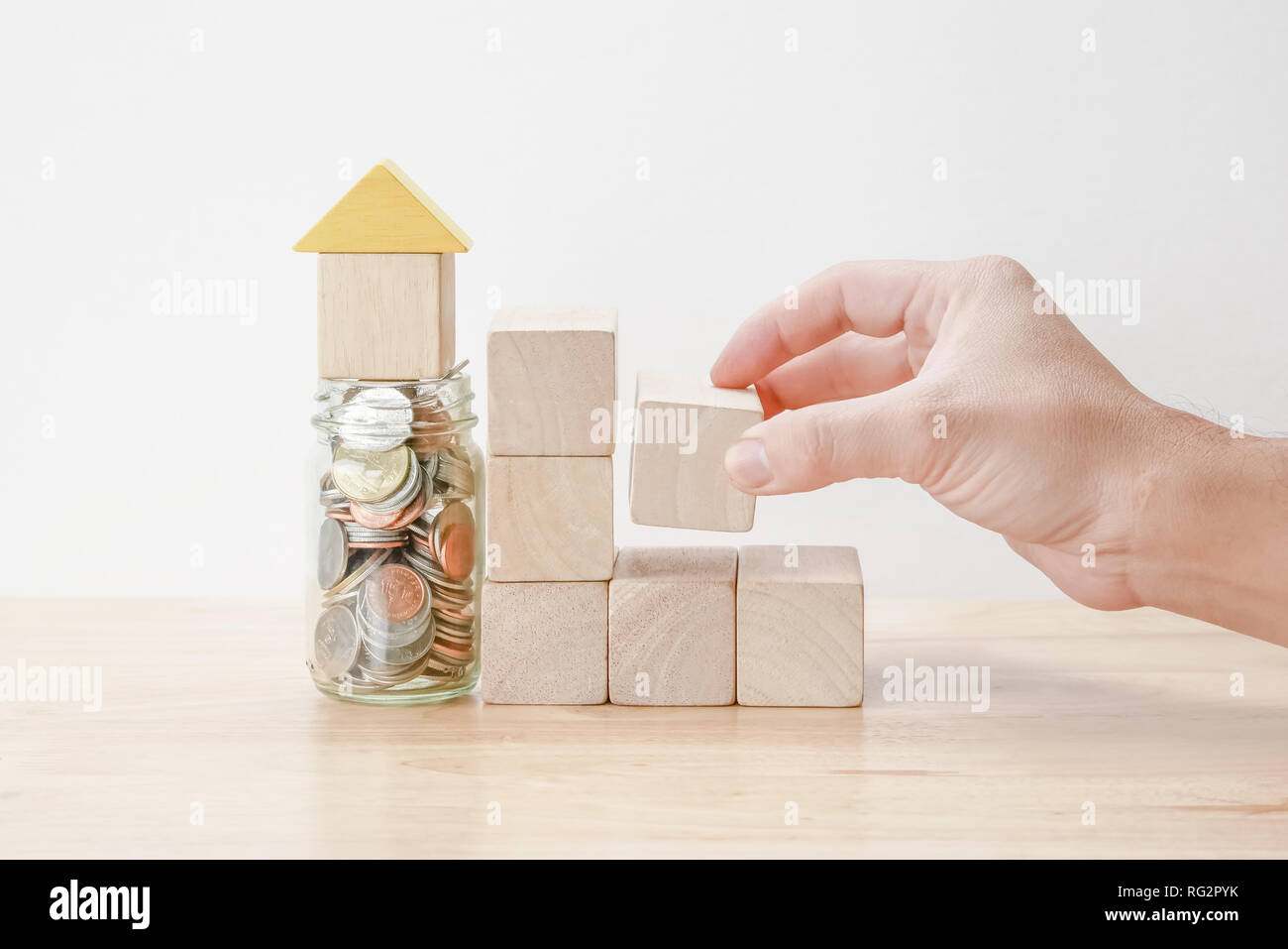 save money for investment mortgage concept by wood block house Stock ...