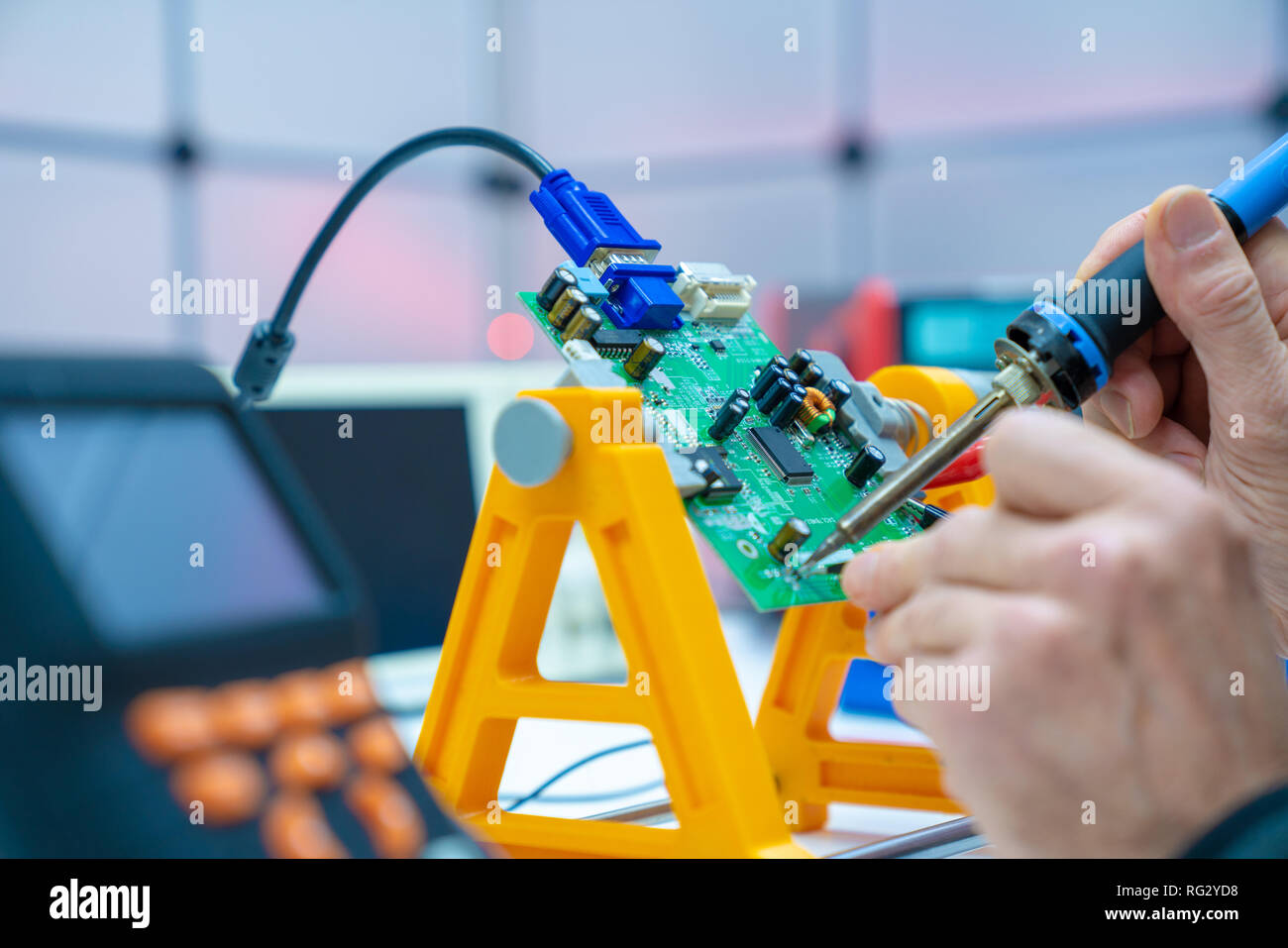 Fixing electronics PCB board in service / workbench with electronics ...