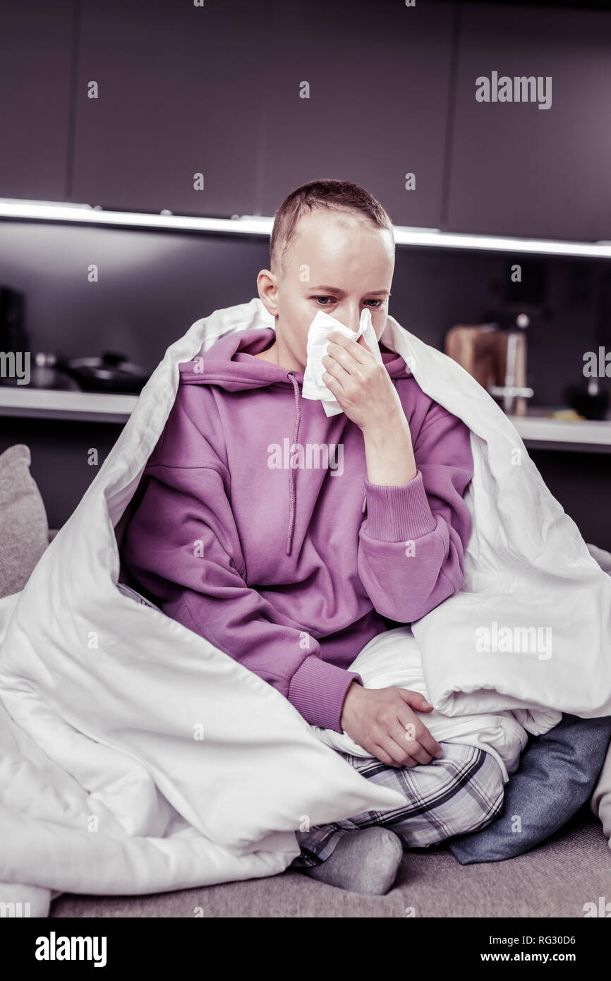 Sick female person suffering fever at home Stock Photo - Alamy
