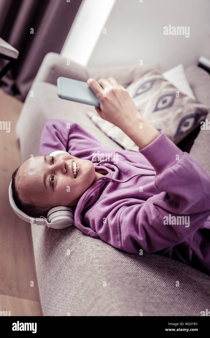 Happy girl using mobile internet with pleasure Stock Photo - Alamy