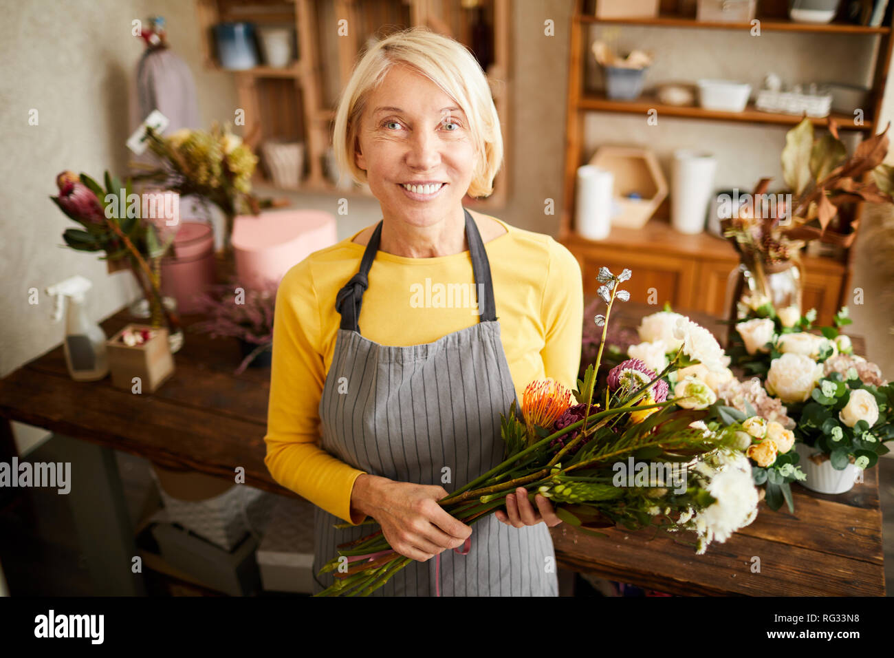 Mature female shop keeper hi-res stock photography and images - Alamy