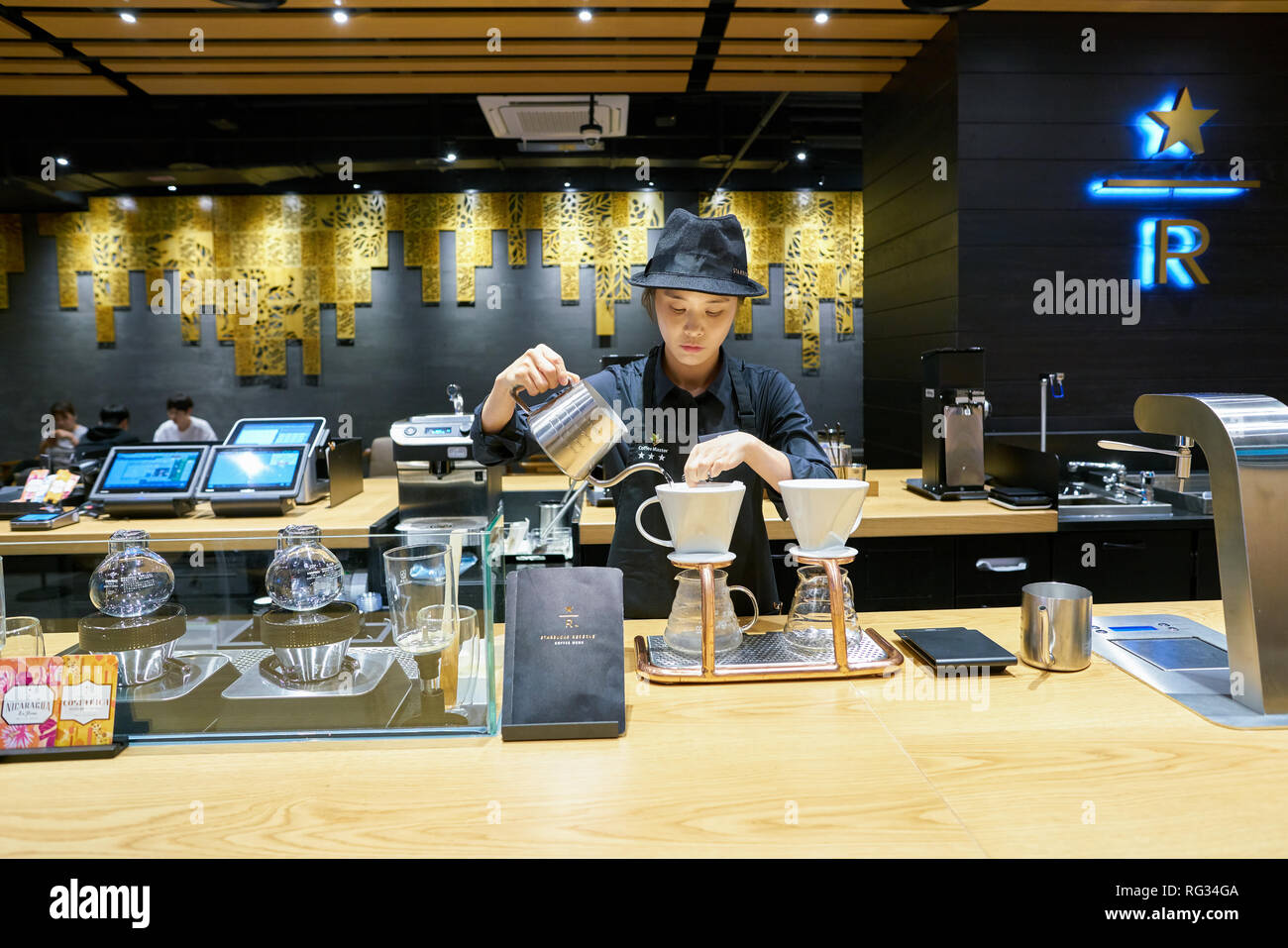 SEOUL, SOUTH KOREA - CIRCA MAY, 2017: worker at Starbucks Reserve ...