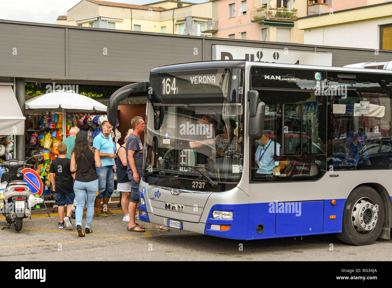 GARDA, ITALY - SEPTEMBER 2018: People catching a public service bus at ...