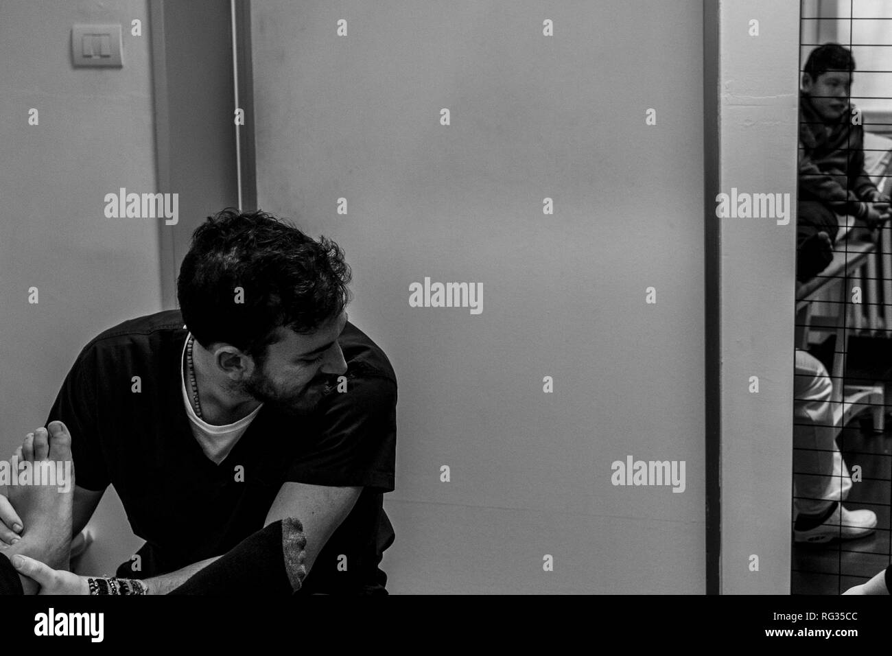 A white italian man, working as a phisiotherapist is photographed while ...