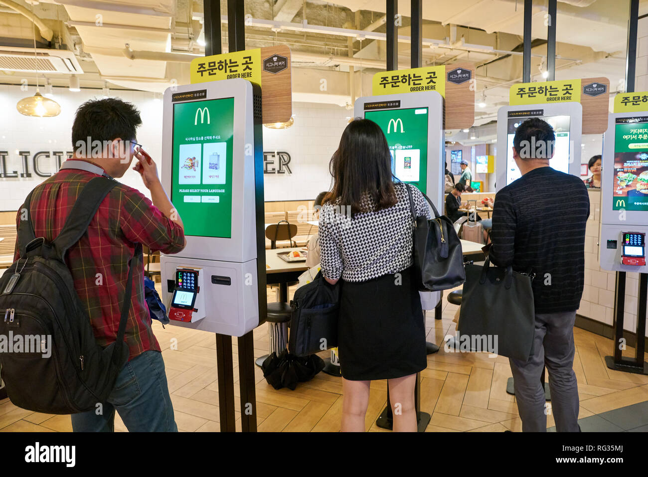 SEOUL, SOUTH KOREA - CIRCA MAY, 2017: people use McDonald's ordering ...