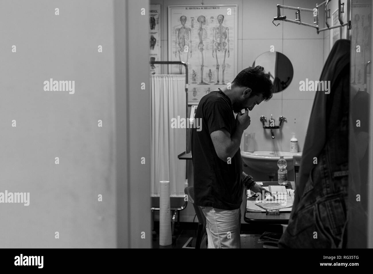 A white italian man, working as a phisiotherapist is photographed while ...