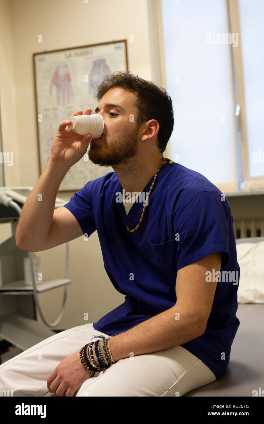 A white italian man, working as a phisiotherapist is photographed while ...
