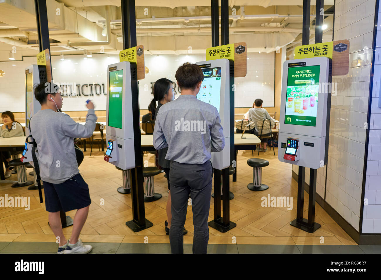 SEOUL, SOUTH KOREA - CIRCA MAY, 2017: people use McDonald's ordering ...