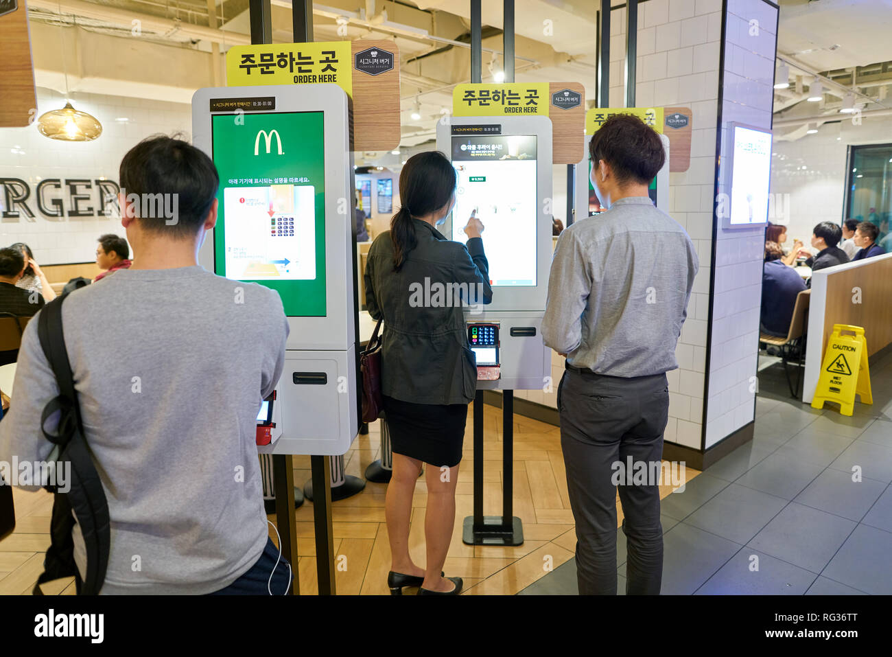 SEOUL, SOUTH KOREA - CIRCA MAY, 2017: people use McDonald's ordering ...