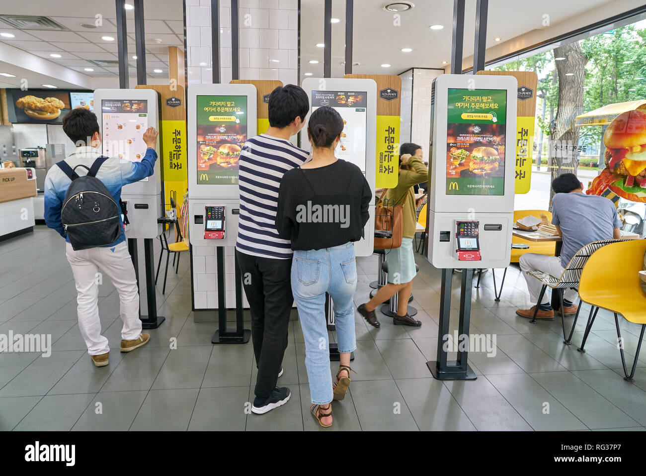 SEOUL, SOUTH KOREA - CIRCA MAY, 2017: people use McDonald's ordering ...