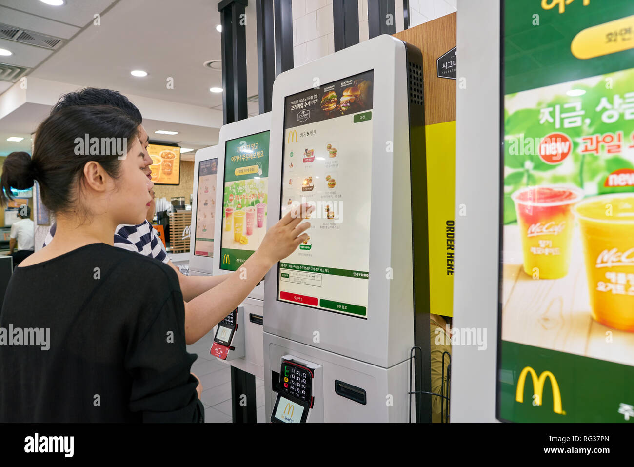 SEOUL, SOUTH KOREA - CIRCA MAY, 2017: people use McDonald's ordering ...