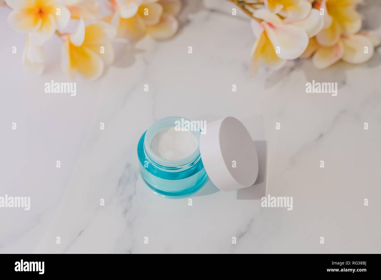 spa and skincare treatments concept, moisturiser pot on marble table ...