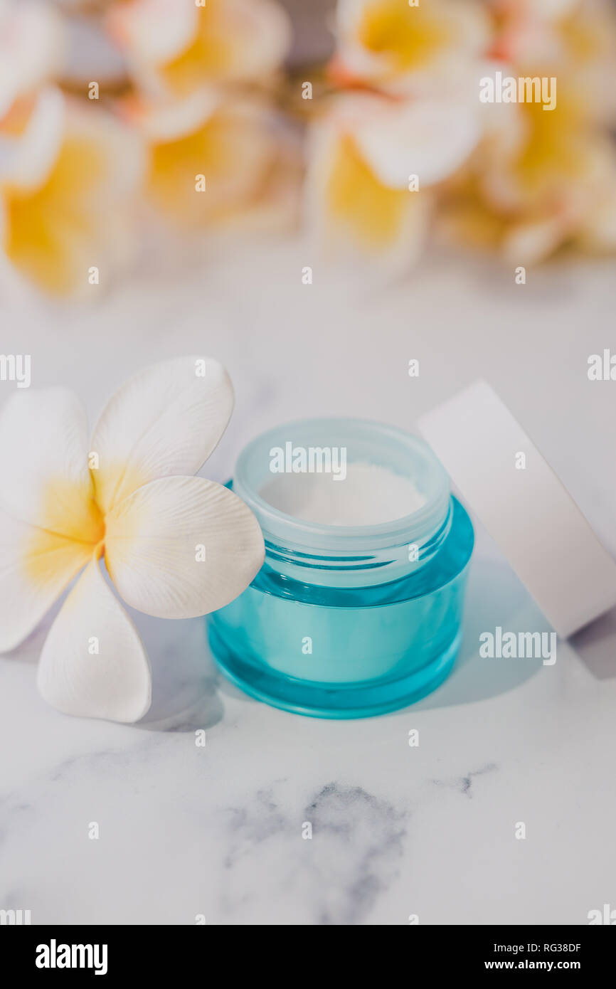 spa and skincare treatments concept, moisturiser pot on marble table ...