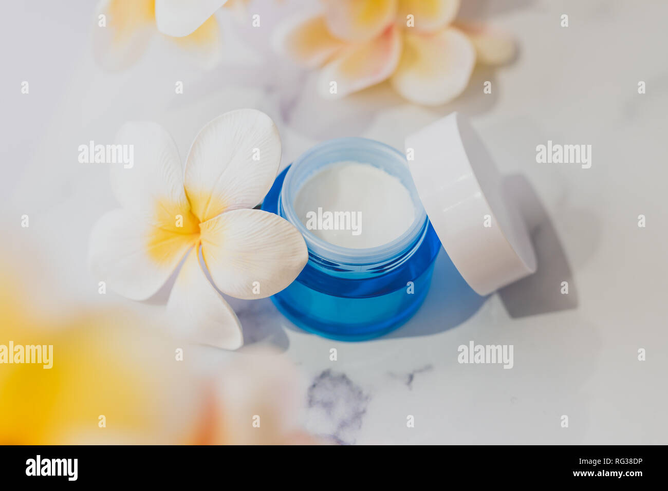 spa and skincare treatments concept, moisturiser pot on marble table ...