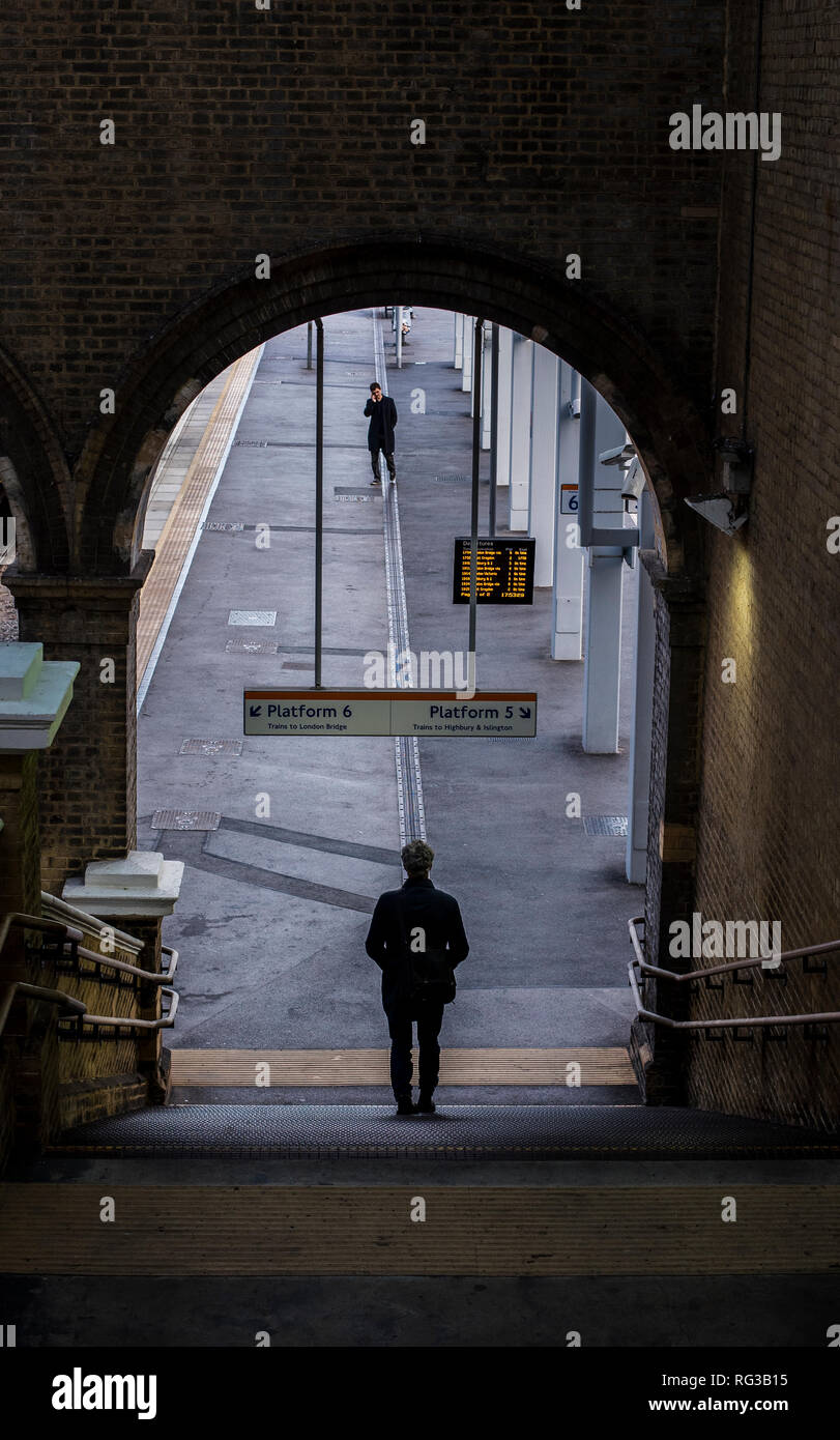 Man walking down slope towards train platform, elevated view, Crystal ...