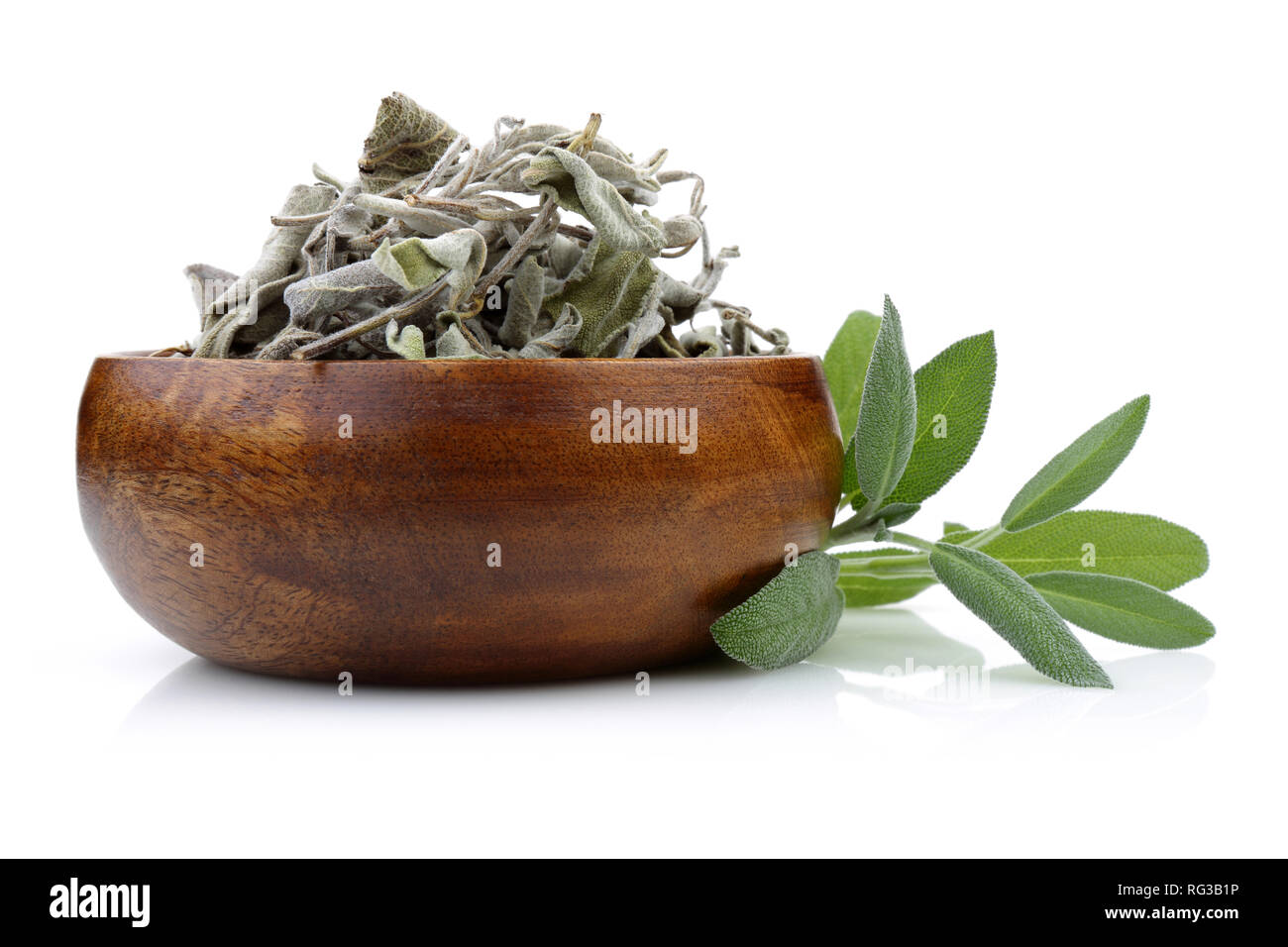 Dry sage in bowl and green sage leaves isolated on white background ...